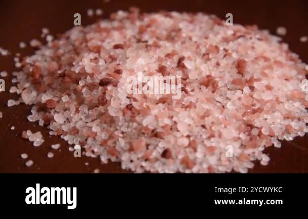 Pink himalayan salt in full screen. Pink salt stones in close up. Pink ...
