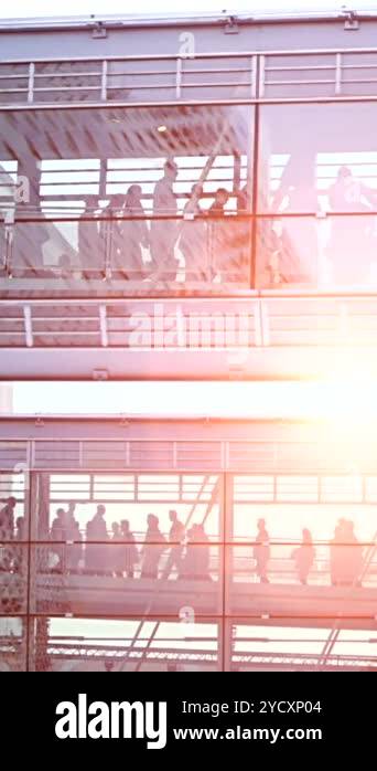 A modern glass structure brimming with people who are savoring stunning ...