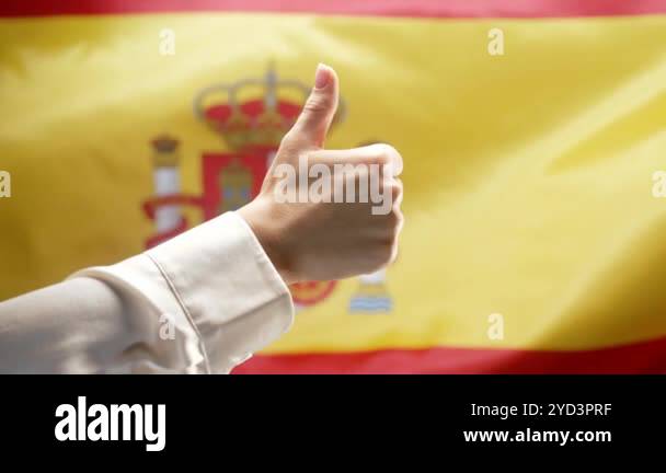 Woman Makes Hand Sign Like, Thumb Up Gesture on spanish flag background ...