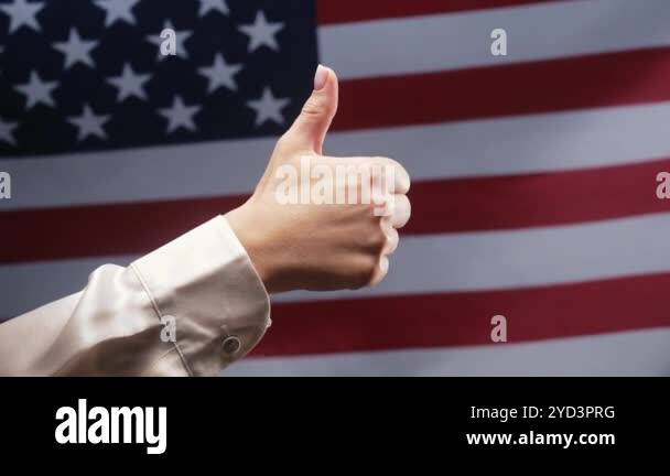 Woman Makes Hand Sign Like, Thumb Up Gesture on american flag ...
