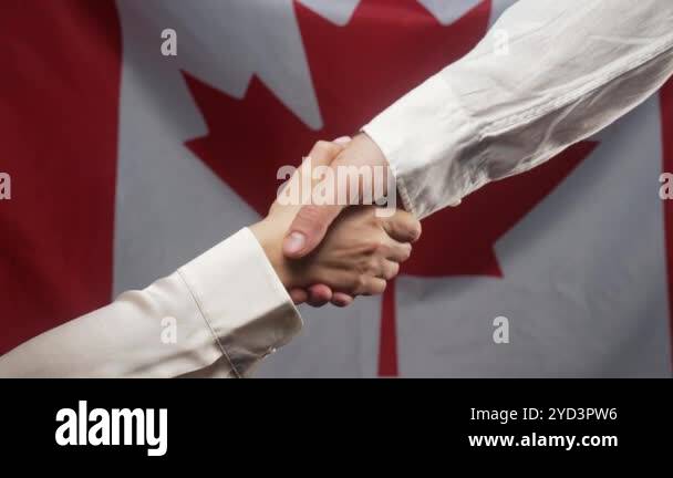 Canadian - Man And Woman Business Partners Shaking Hands. Handshake ...