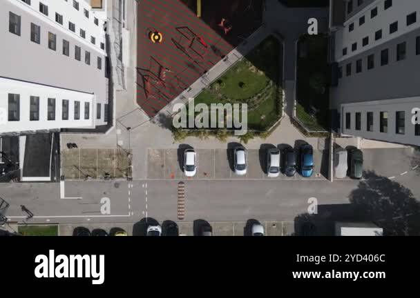 Top-down drone view of a modern residential courtyard with a playground ...