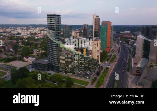 Aerial views capture cars moving through a bustling street in Vilnius ...
