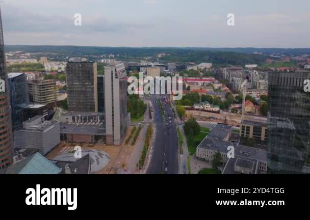 Cars navigating a lively city street showcase a blend of contemporary ...