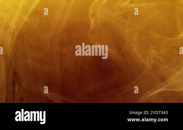 Sparkling smoke. Paint water splash. Defocused yellow bronze golden ...