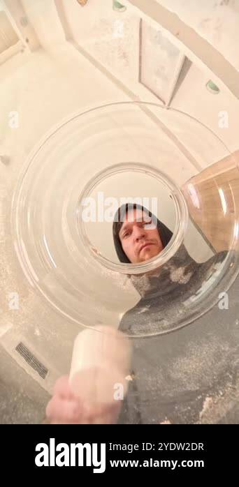Vertical video. Macro zoom view from inside a Protein Powder Jar ...