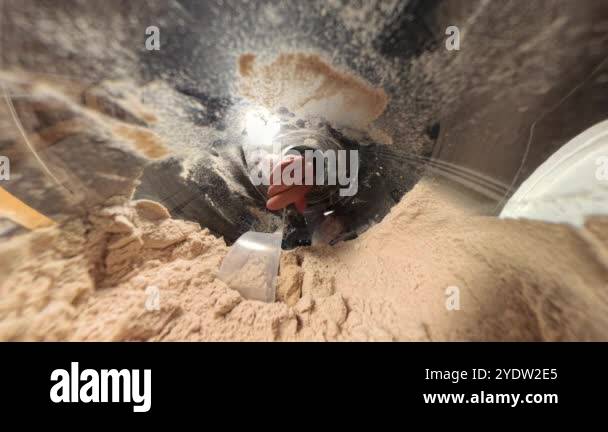 Zoom in, View from inside a Protein Powder Jar, a Man hand scoops ...