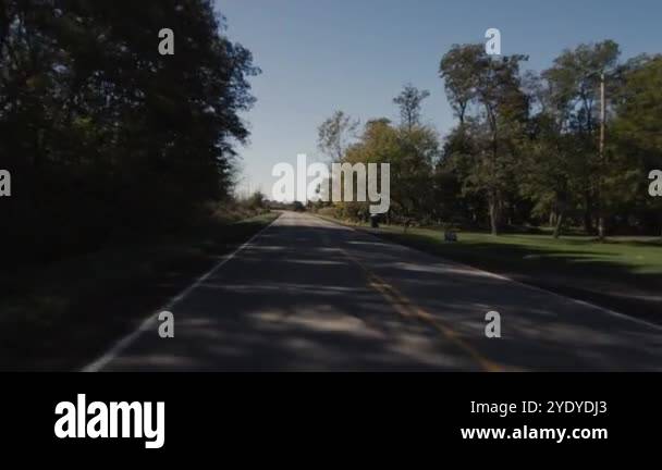 Driving straight on a flat road in a typical American agricultural ...