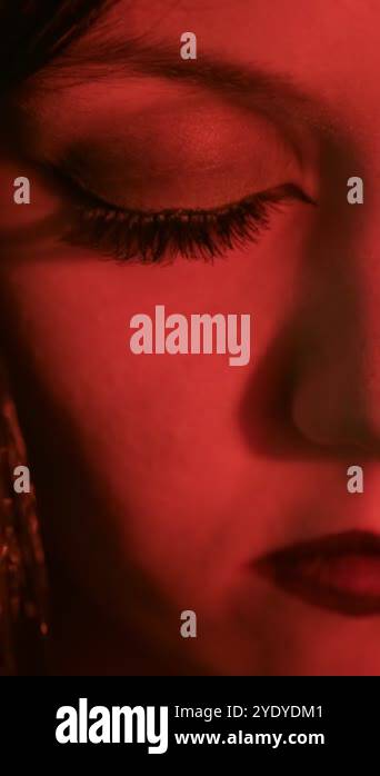 A dramatic close-up video of a witchs eye, initially closed, then ...