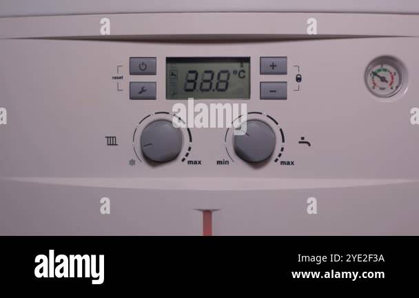 Close-up of the control panel of a combi gas boiler, focusing on ...