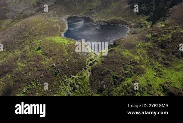 An aerial view of Lough Ouler from Tonelagee mountain. Mountain lake in ...