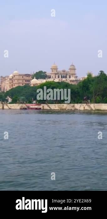 Udaipur City Palace view from moving boat on lake Pichola. Luxury ...