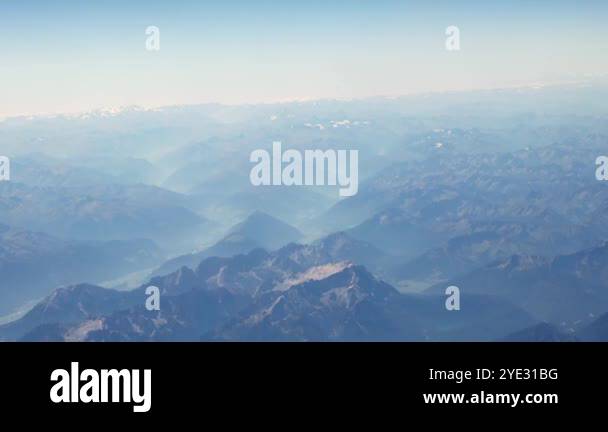 Beautiful atmospheric view of black mountain ranges shrouded in blue ...
