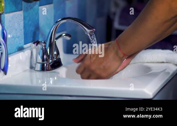 Hand washing, health awareness, Close-up view of a man washing his ...