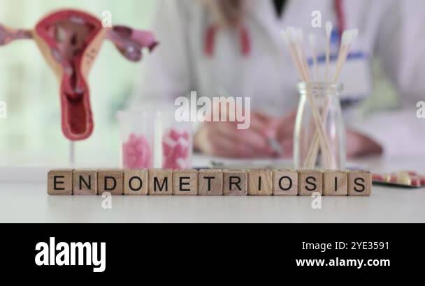 Word Endometriosis on gynecologist desk with uterus anatomical model ...