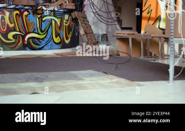 Empty abandoned warehouse with graffiti paintings on walls, concept of ...