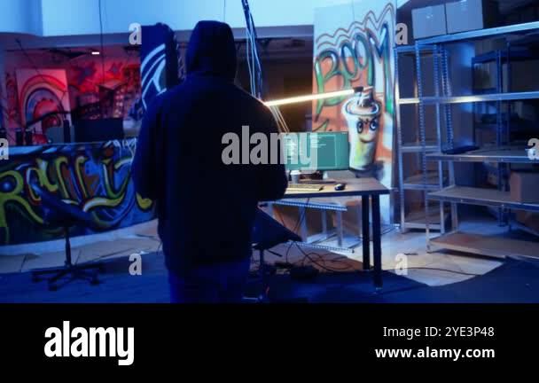 Hacker Arriving With Tablet In Hidden Base Deploying Viruses On Unaware Victims Computers