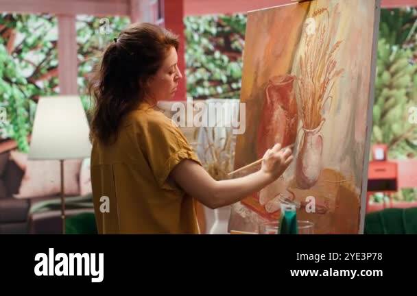 Artist uses talent and tie dye to create a masterpiece on canvas in creative workshop, blending ...