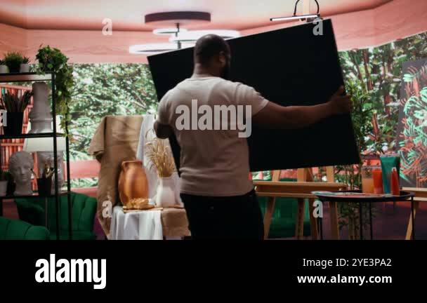 Artist is mixing different dye colors on a palette to create the ...