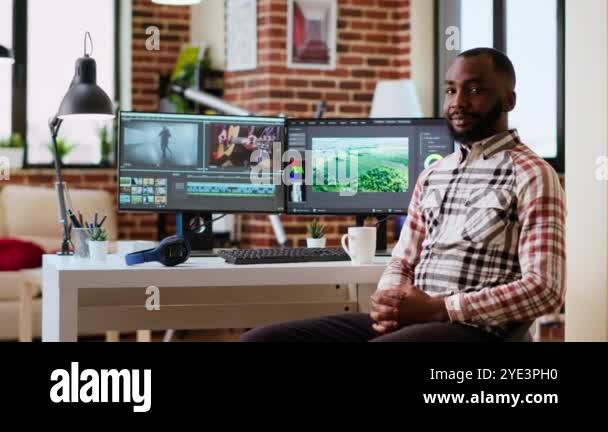 African american male filmmaker works with creative editing software ...