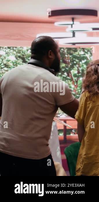 Vertical Video Talented artist and her apprentice applying watercolor ...