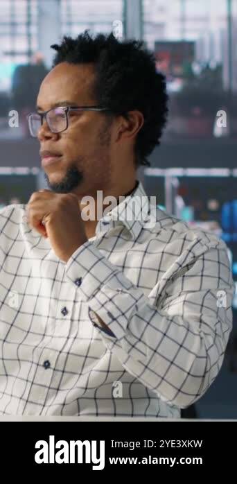 Vertical video Confident happy CEO does peace sign at photographs on ...