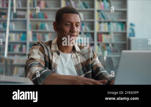 Happy African American man guy student library high school university ...