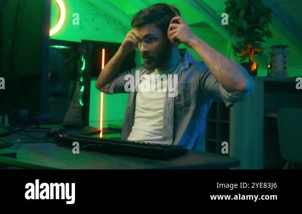 Happy Indian man put on headphone talking to microphone start online ...