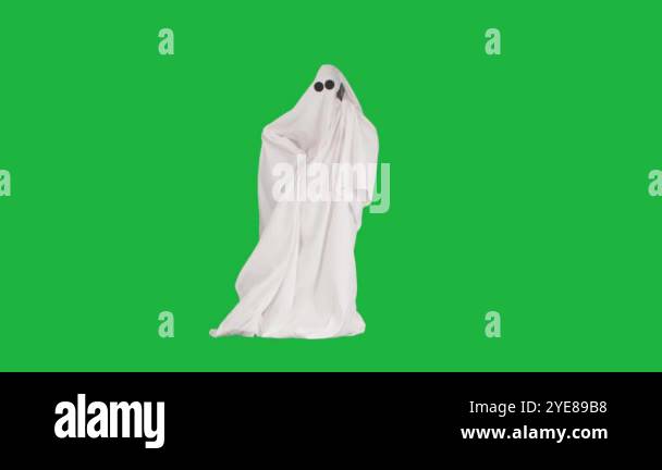 Person dressed as ghost posing at camera. Halloween ghost in white ...