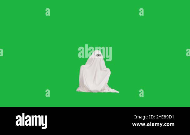 Person dressed as ghost posing at camera. Halloween ghost in white ...