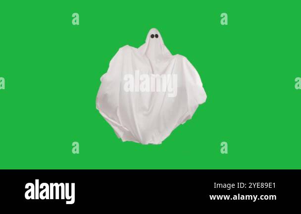 Person dressed as ghost posing at camera. Halloween ghost in white ...