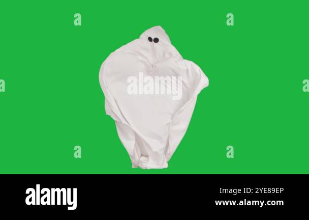 Person dressed as ghost posing at camera. Halloween ghost in white ...