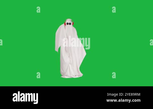 Person dressed as ghost posing at camera. Halloween ghost in white ...