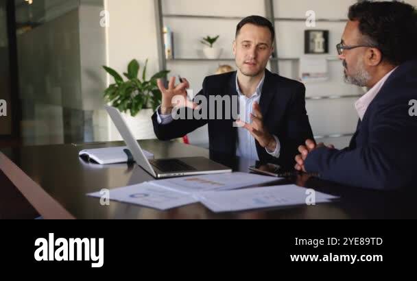 Client and manager presents detailed proposal to client during negotiation process in company ...