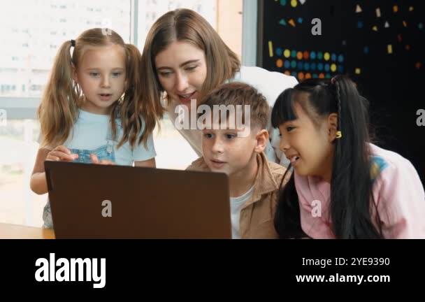 Caucasian teacher looking at african learner work or presentation ...