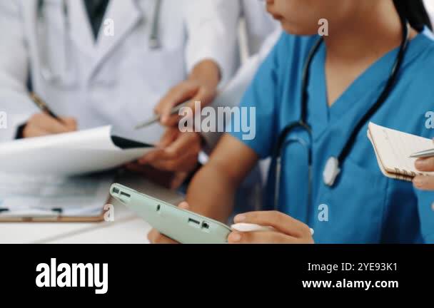 Professional group of medical working and planning medical treatment or ...