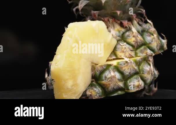 Close up video of fresh pineapple with slice of peel pineapple insert ...