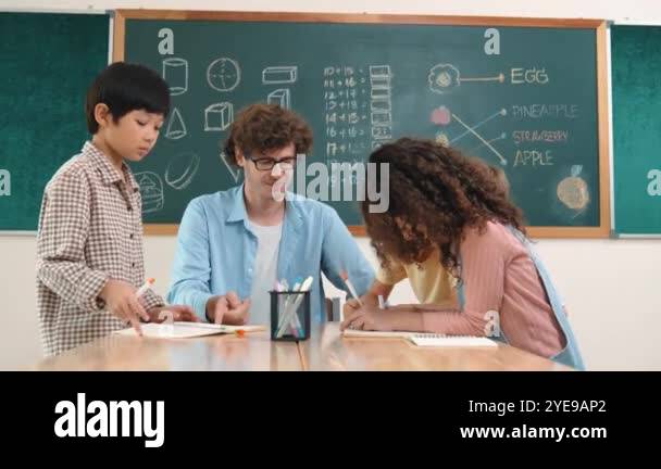 Smart teacher explain idea while diverse children drawing mind map ...