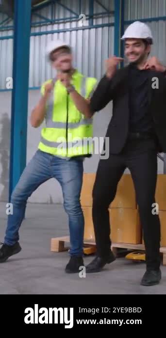 Funny factory workers dance in the factory . Happy people at work Stock ...