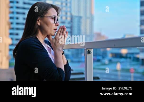 Sad upset stressed mature woman, outdoor portrait. Middle aged serious ...