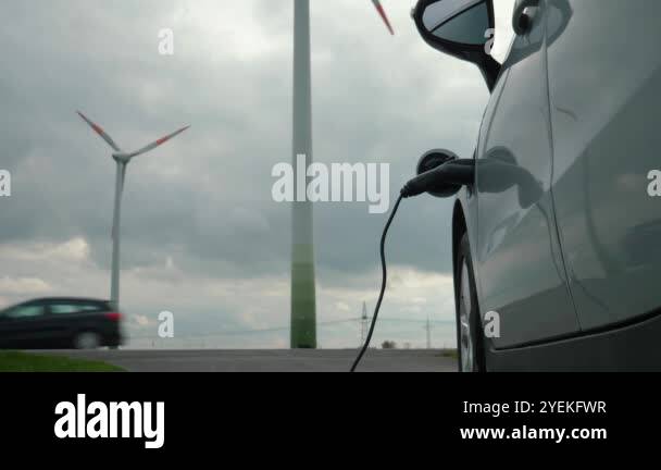 Electricity from wind station charging EV battery directly powered by ...