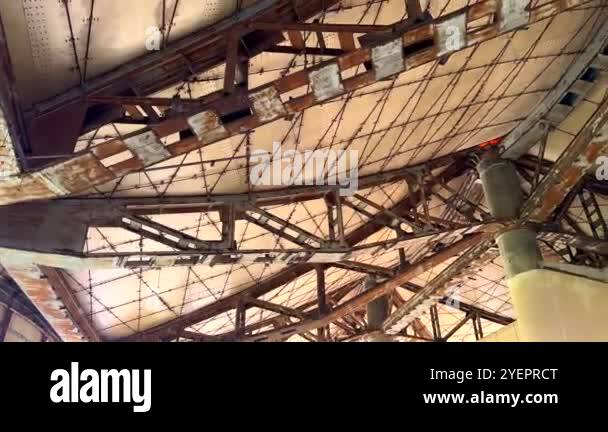 Rusted framework forms intricate grid pattern in abandoned desert ...