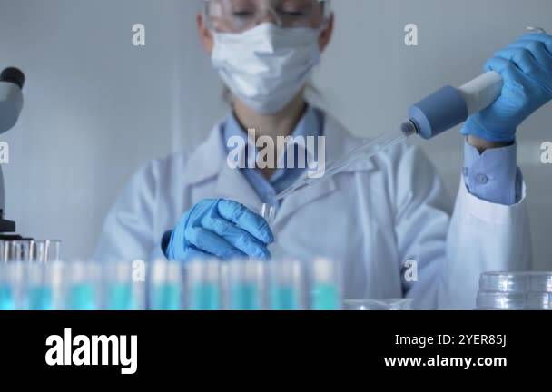 Scientist woman researcher, wearing a lab coat, mask, and safety ...