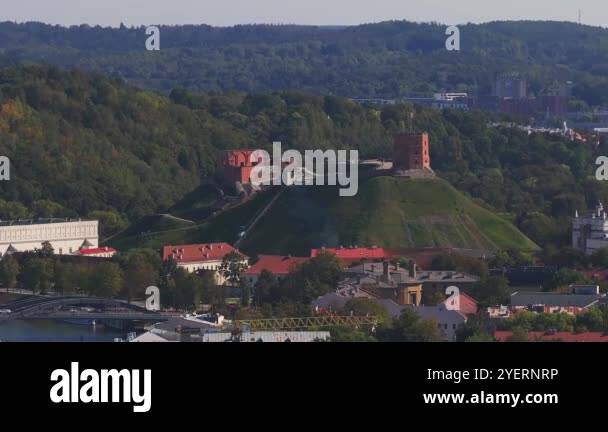 Gediminas Tower stands on a hill with a mural of clasped hands ...