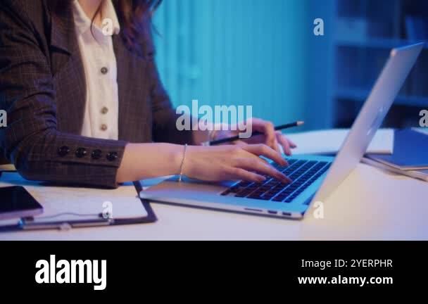 Close-up of a Womans Hands Typing on a Laptop in a Late-Night Office ...