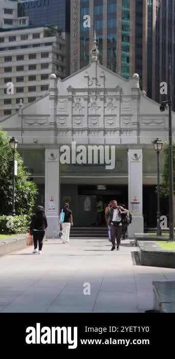 Singapore- 27 Oct 2024: View of Raffles place subway entrance building ...