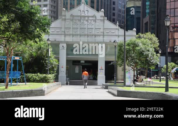 Singapore- 27 Oct 2024: View of Raffles place subway entrance building ...