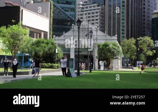 Singapore- 27 Oct 2024: View of Raffles place subway entrance building ...
