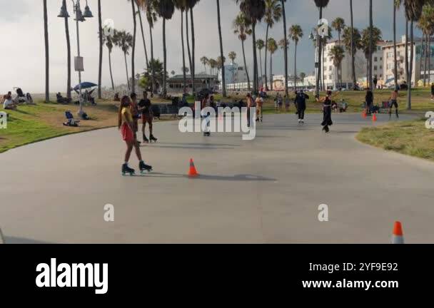 a man skates down a roller coaster santa monica beach in los angeles ...