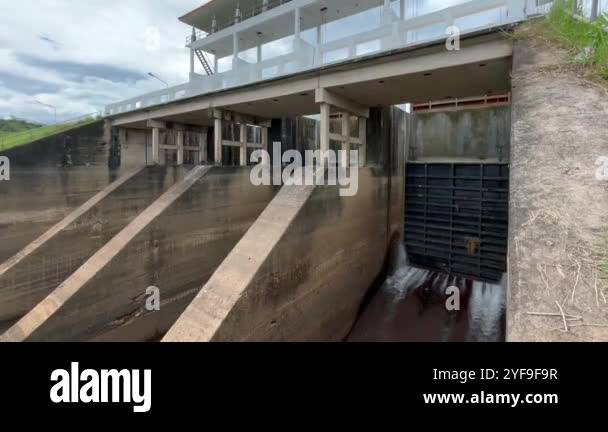 spillway gate of a concrete dam. This industrial structure channels ...